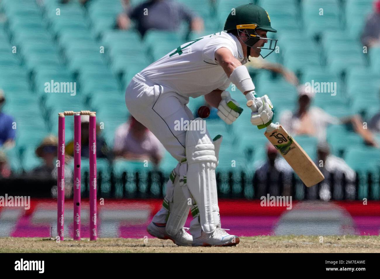 South Africa's Dean Elgar is hit in the mid-section with a delivery ...
