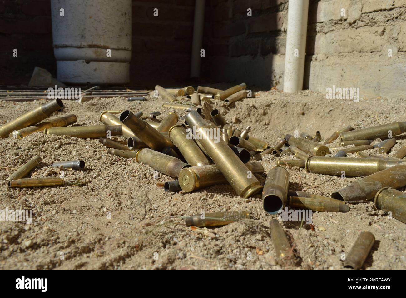 Spent bullet casings litter the ground near a house in Jesus Maria ...