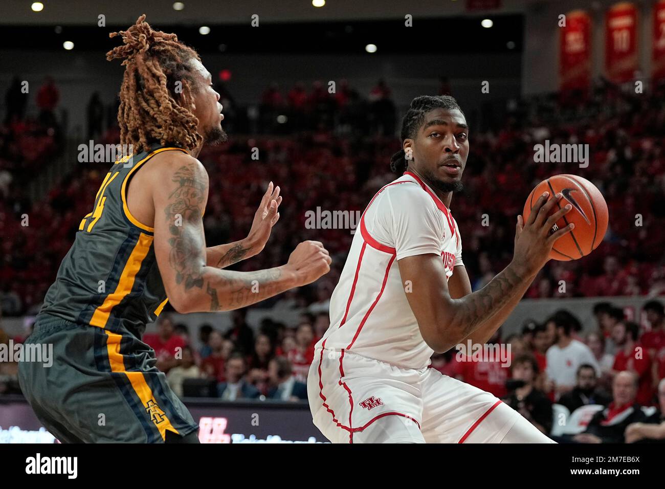 Houston forward Ja'Vier Francis (5), right, posts-up on North Carolina ...