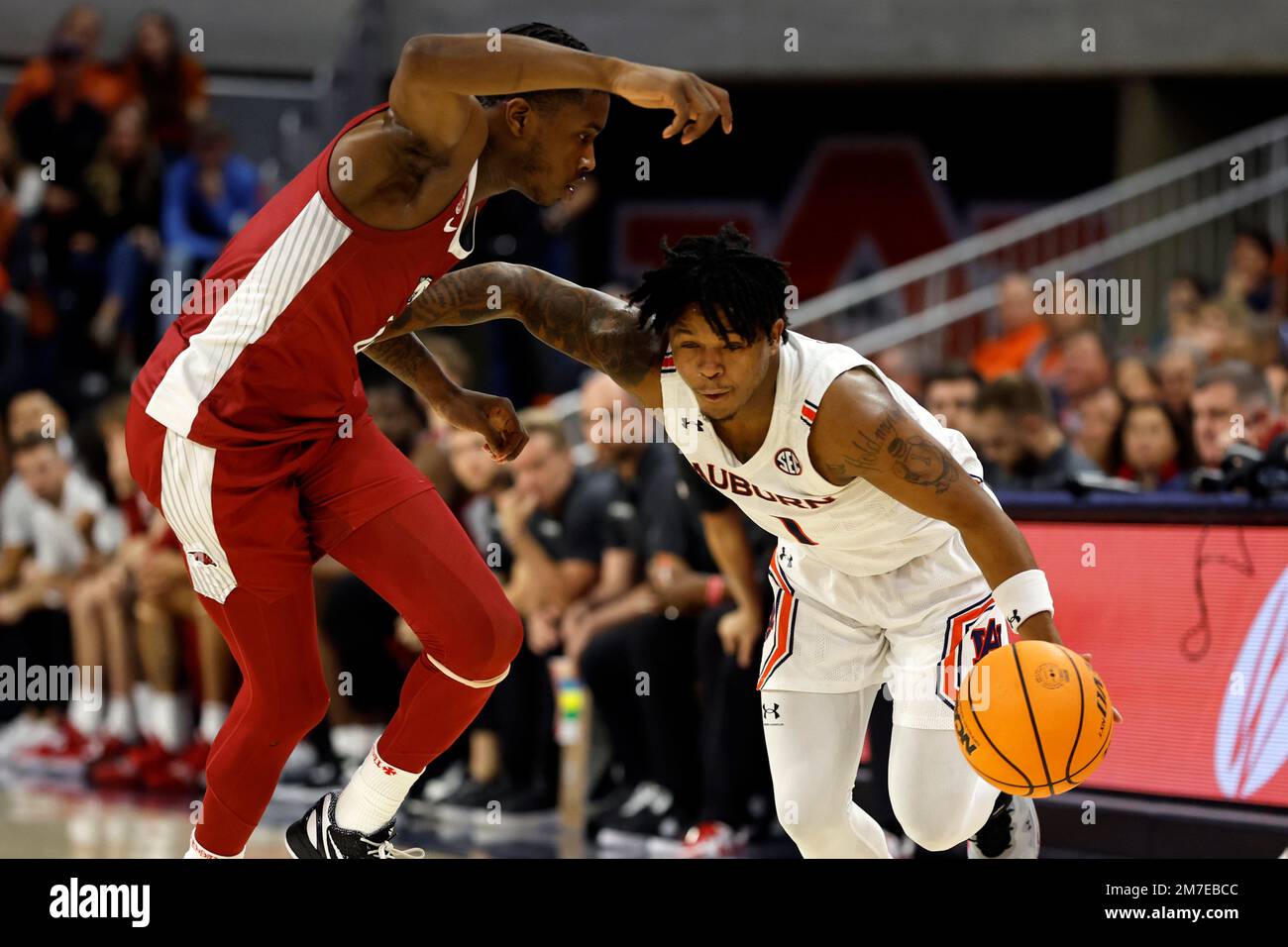 Auburn guard Wendell Green Jr. (1) dribbles around Arkansas guard Davonte Davis (4) during the ...