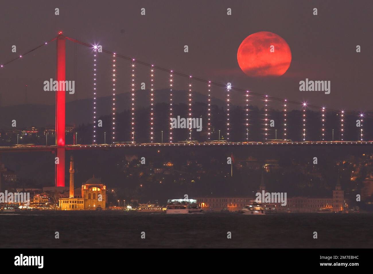 The first full moon of the year rises behind the 15 July Martyrs bridge ...