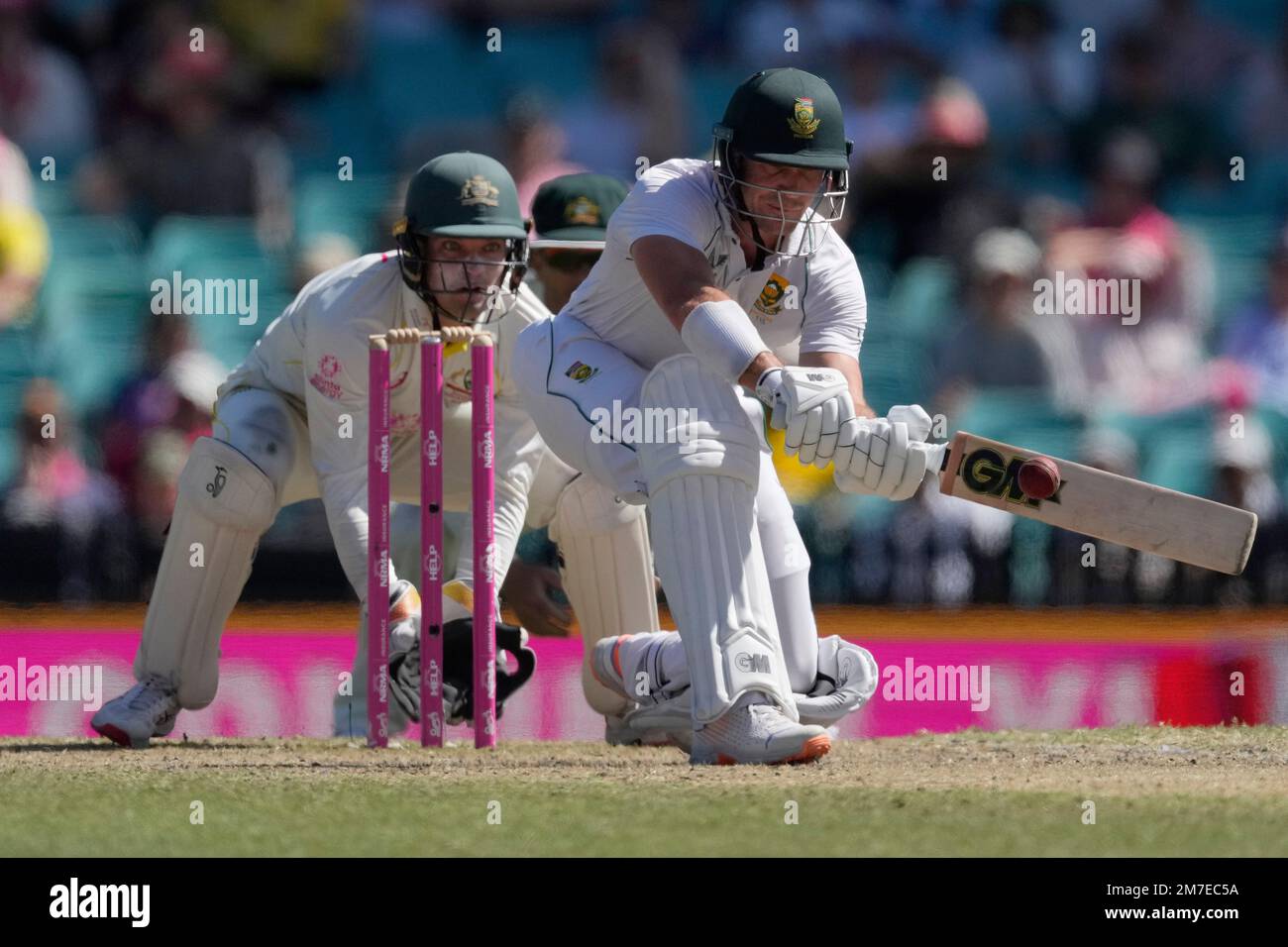 South Africa's Sarel Erwee, right, bats in front of Australia's Alex ...