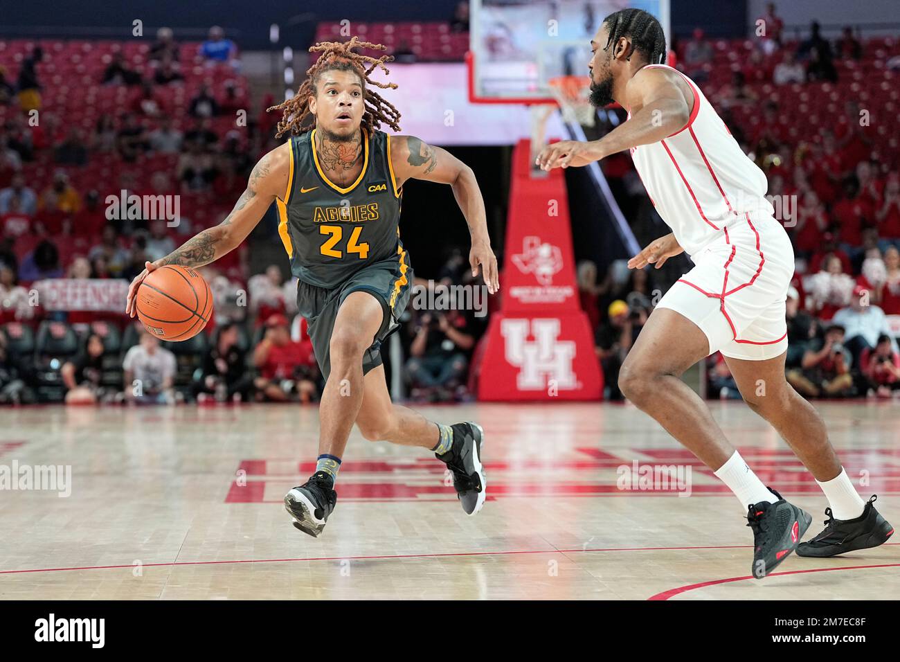 North Carolina A&T guard Demetric Horton (24) is defended by Houston ...