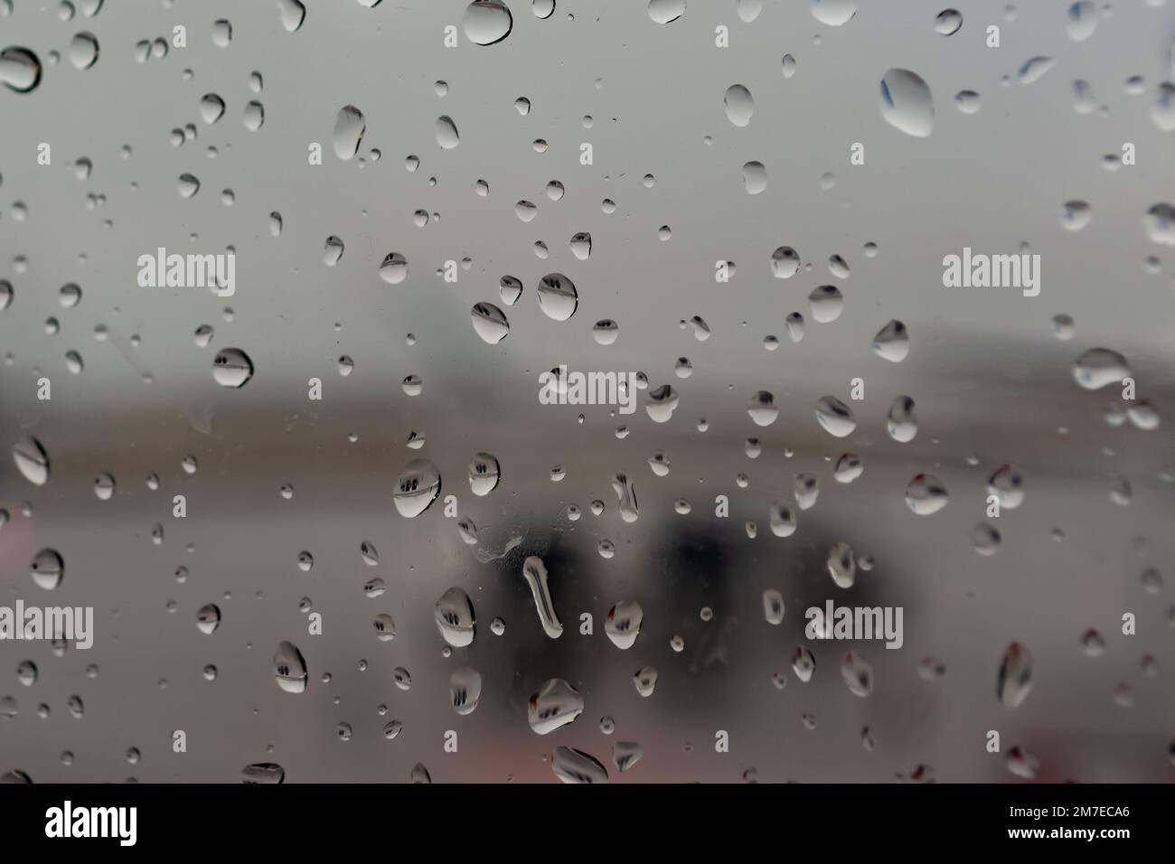 looking out a window as the rain is falling down Stock Photo - Alamy