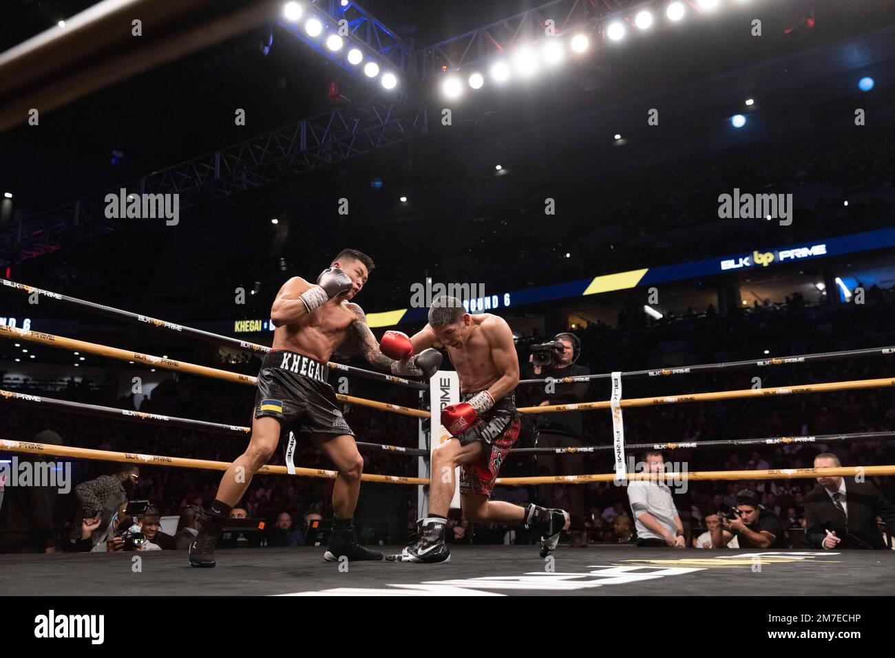 Arnold Khegai, left, fights Eduardo Baez during a featherweight boxing ... Arnold Khegai, left, fights Eduardo Baez during a featherweight boxing ...