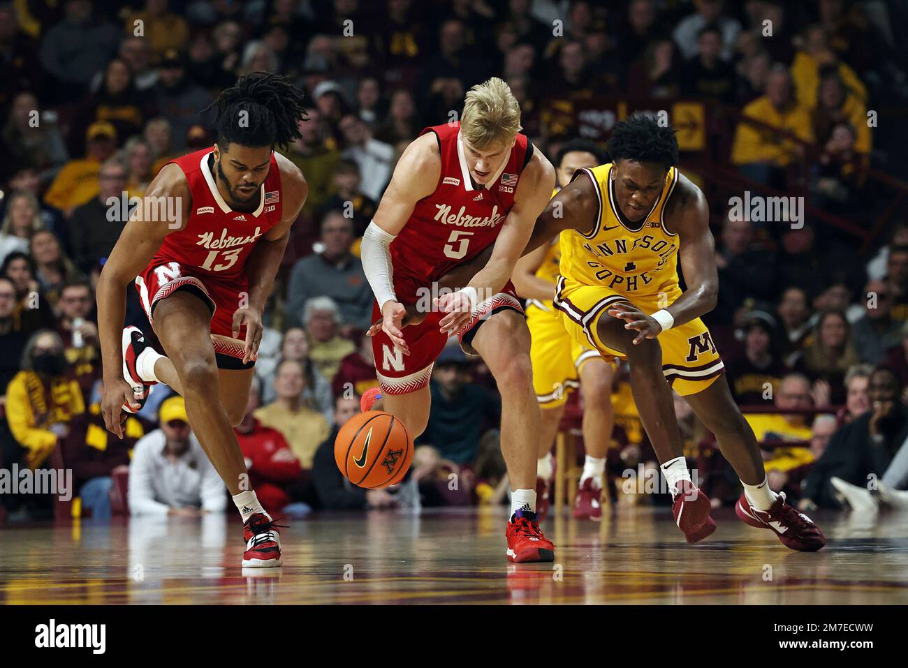 Nebraska guard Sam Griesel (5) scrambles for the ball against Minnesota ...