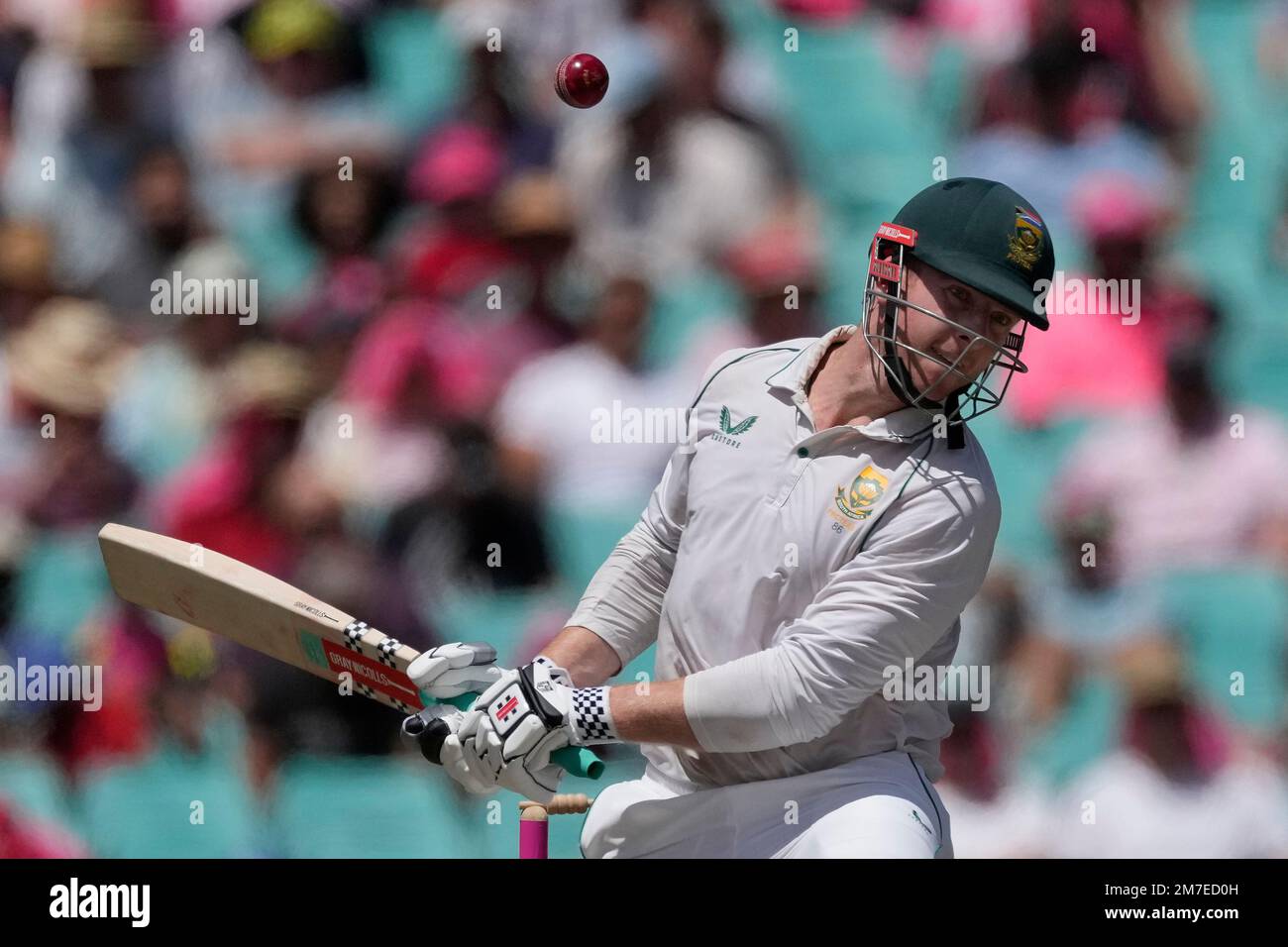 South Africa's Simon Harmer avoids a bouncer from Australia's Josh ...