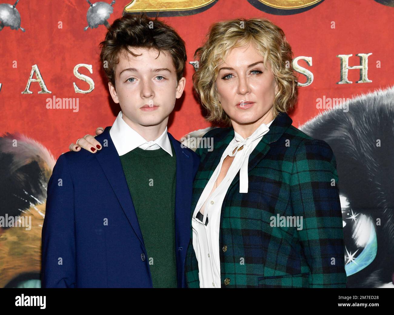 Amy Carlson, right, and son Nigel Butler attend the premiere of "Puss ...