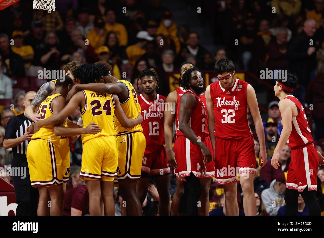 Minnesota players huddle on the court during the second half of an NCAA ...