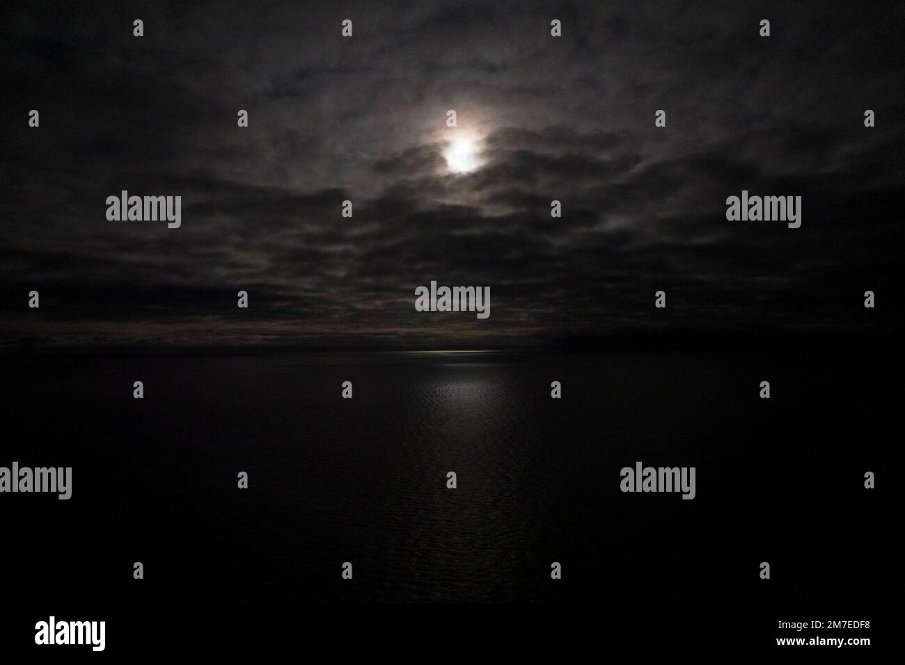 The first full moon of the year lights the ocean in Svalbard, Norway ...