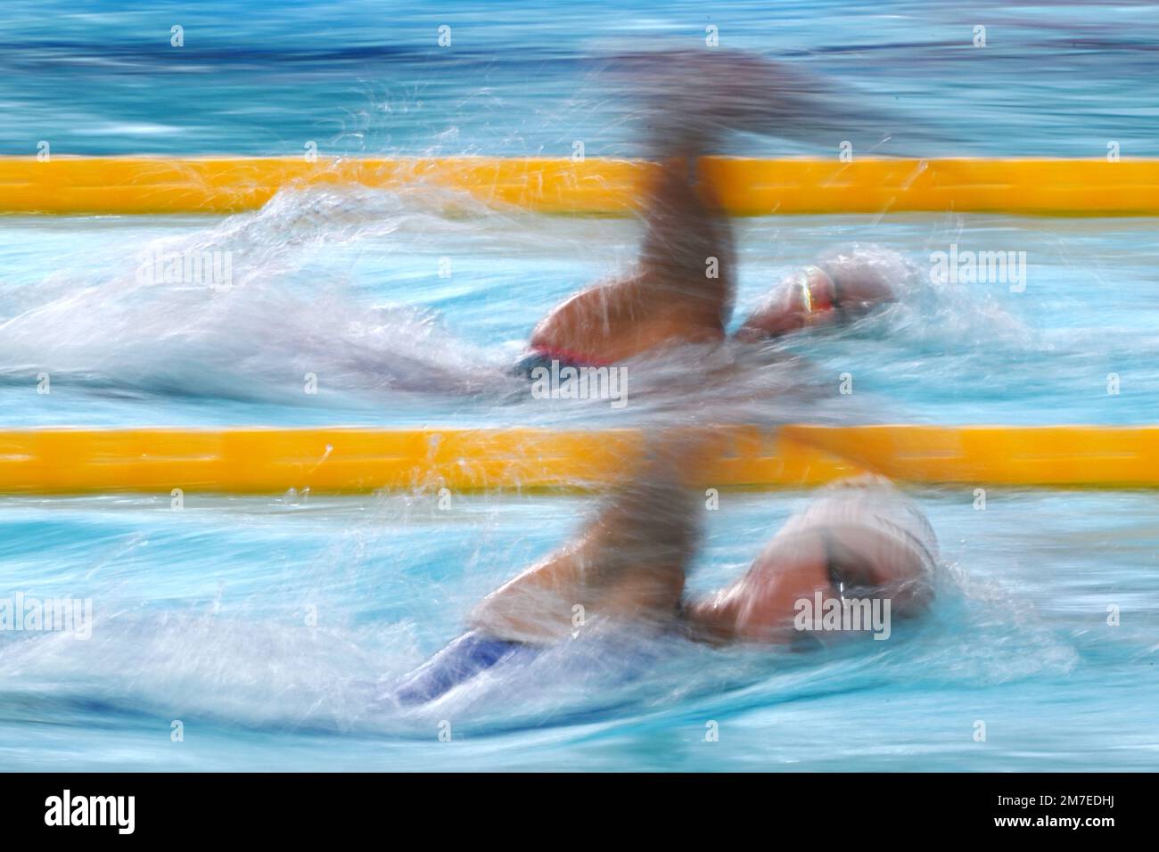 Competitors swim in the women's 800m freestyle timed heat during the ...