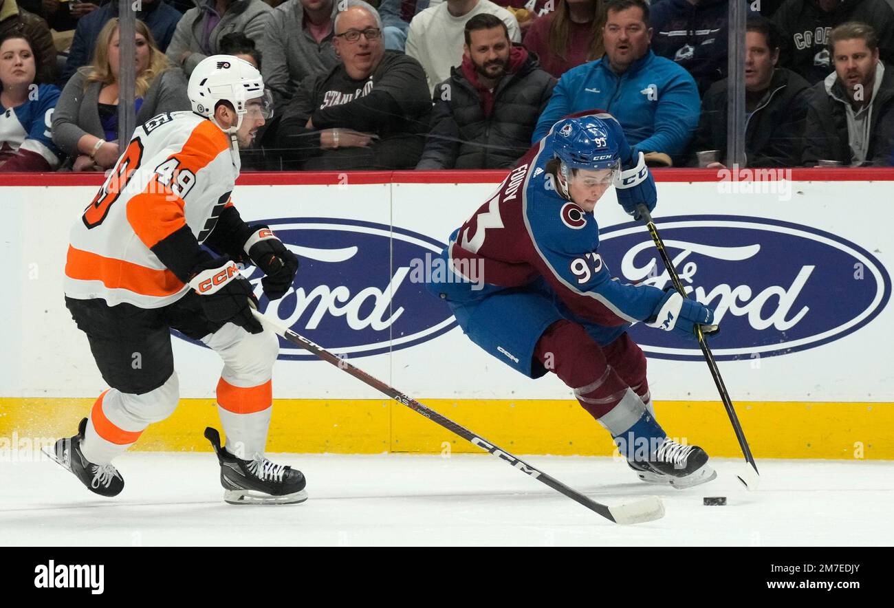 Colorado Avalanche center Jean-Luc Foudy, right, drives past ...