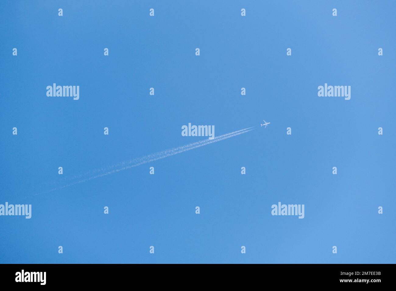 A jet aircraft passes over head through light cloud. disappearing ...