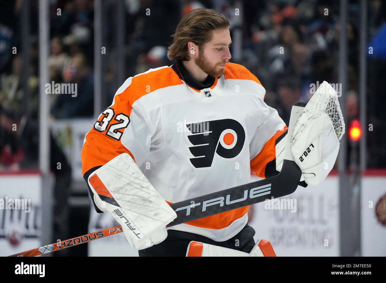Philadelphia Flyers goaltender Felix Sandstrom checks his stick in the ...
