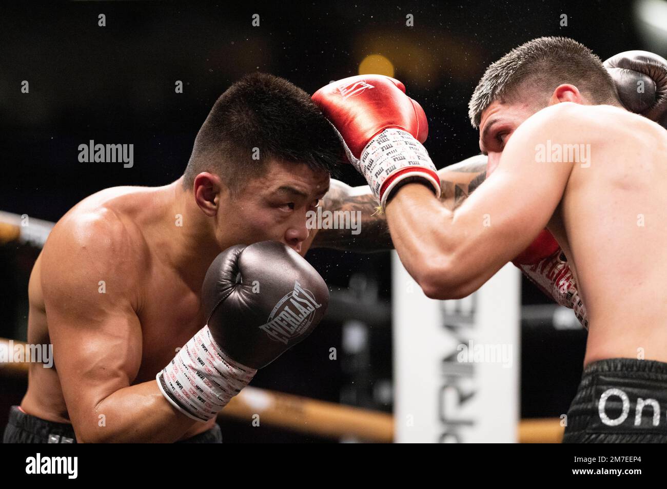 Arnold Khegai, left, fights Eduardo Baez during a featherweight boxing ... Arnold Khegai, left, fights Eduardo Baez during a featherweight boxing ...