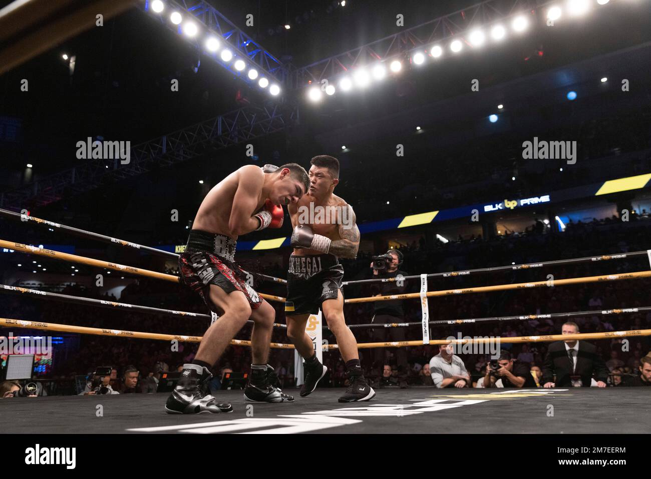 Arnold Khegai, right, fights Eduardo Baez during a featherweight boxing match on Saturday, Dec ...
