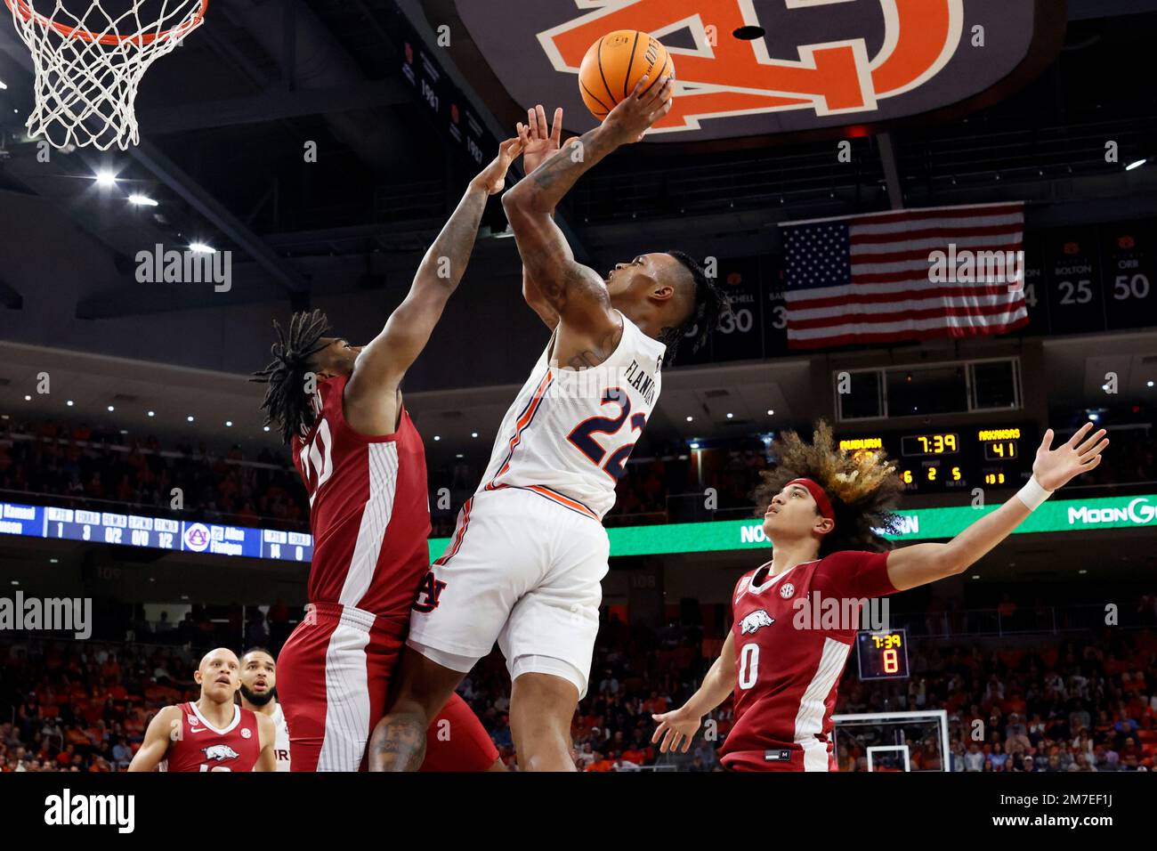 Auburn guard Allen Flanigan (22) shoots over Arkansas forward Kamani Johnson (20) during the ...