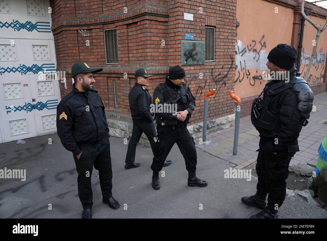 Iranian police officers protect the French Embassy in Tehran during a ...