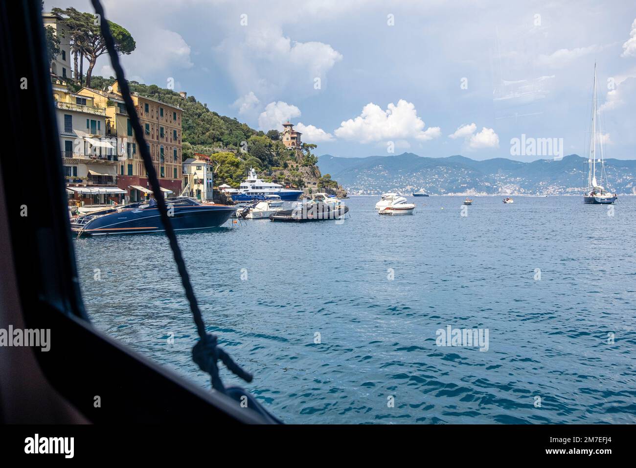 Looking out of the window of a tourist boat at the sea with a motor ...