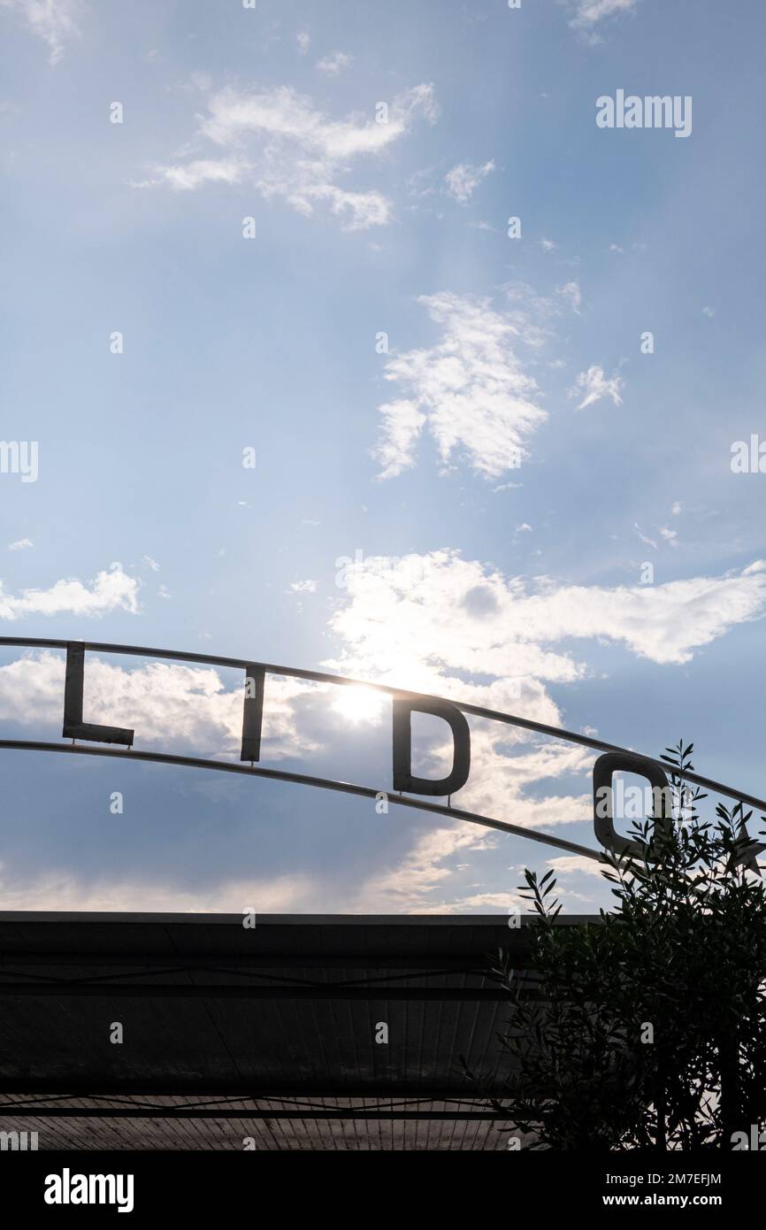 A large overhead sign saying Lido showing where the local swimming pool ...
