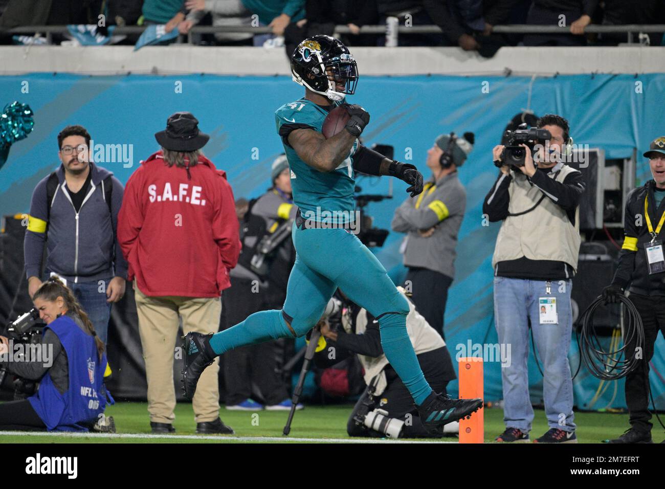 Jacksonville Jaguars linebacker Josh Allen (41) returns a fumble for a ...