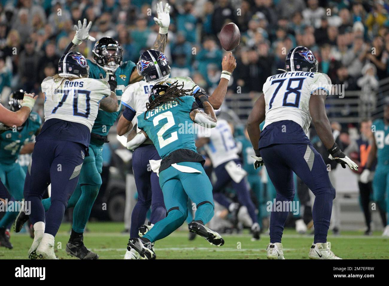 Tennessee Titans quarterback Joshua Dobbs fumbles as he is hit by ...