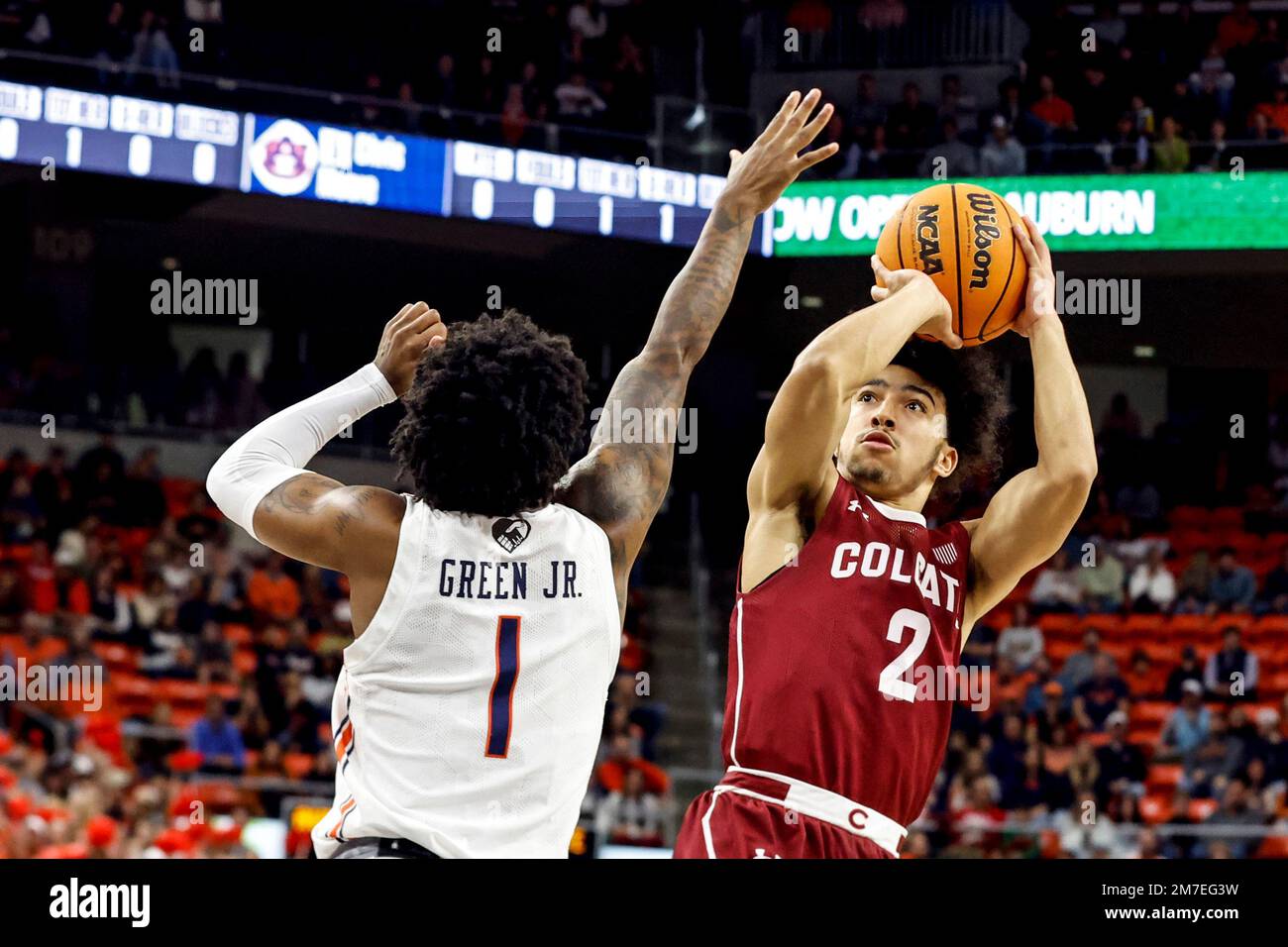 Colgate guard Braeden Smith (2) shoots over Auburn guard Wendell Green ...