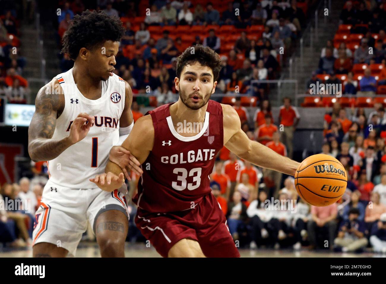 Colgate guard Oliver Lynch-Daniels (33) dribbles around Auburn guard ...