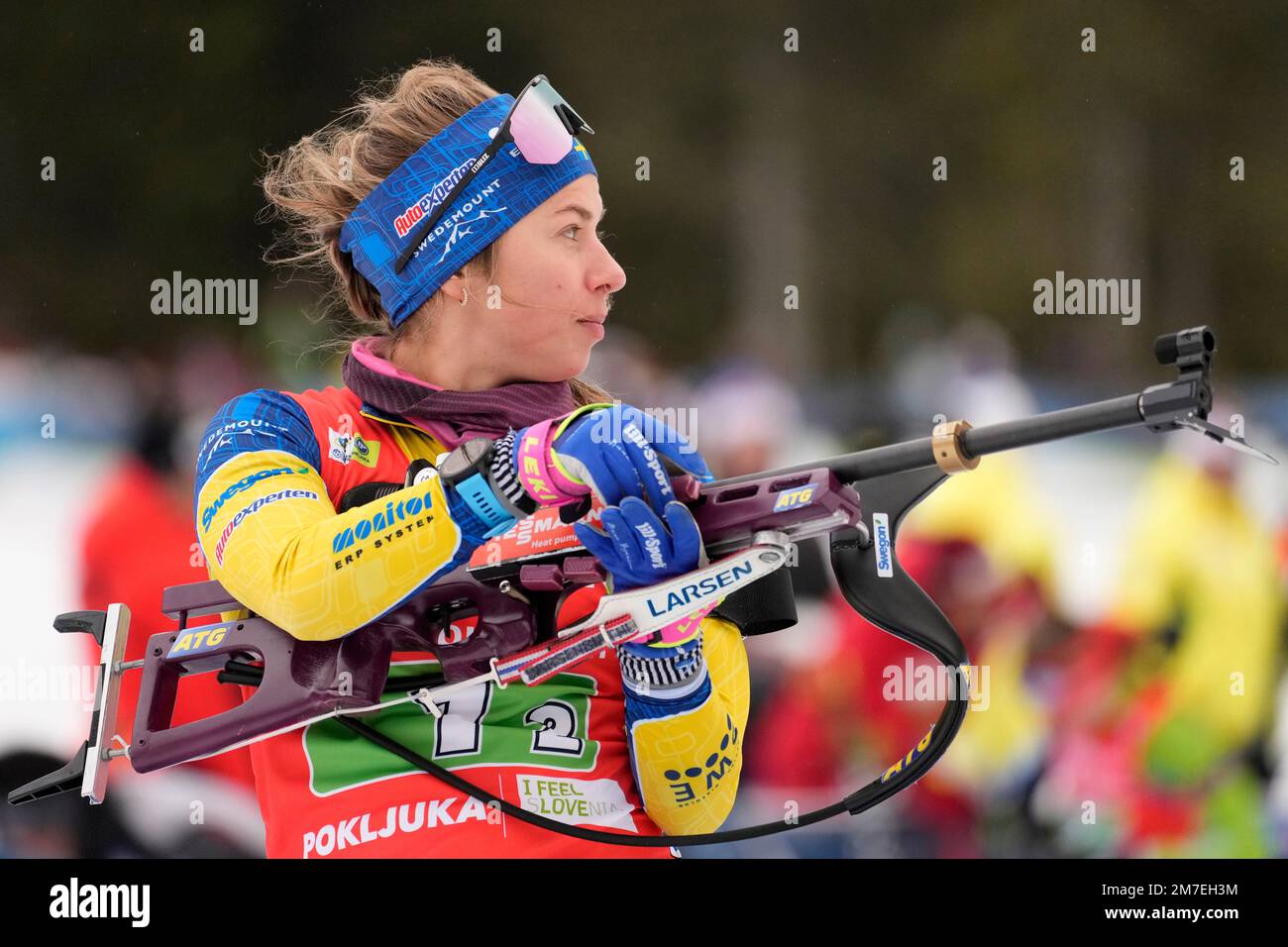 Linn Persson, of Sweden, handles her rifle during warmup before the ...