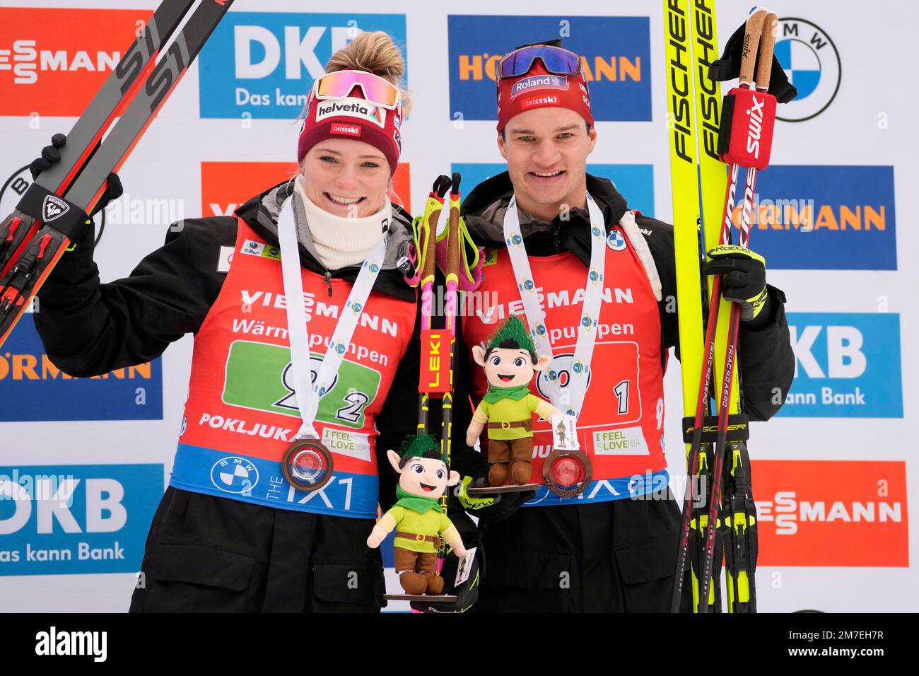 Amy Baserga and Niklas Hartweg, of Switzerland, pose on the podium ...