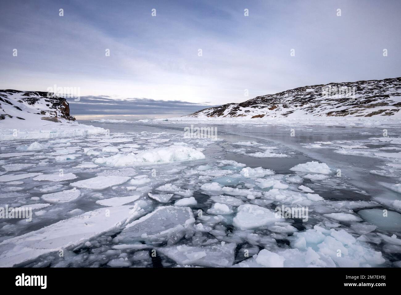 Sea ice in the bay at Oqaatsut settlement in west Greenland Stock Photo ...
