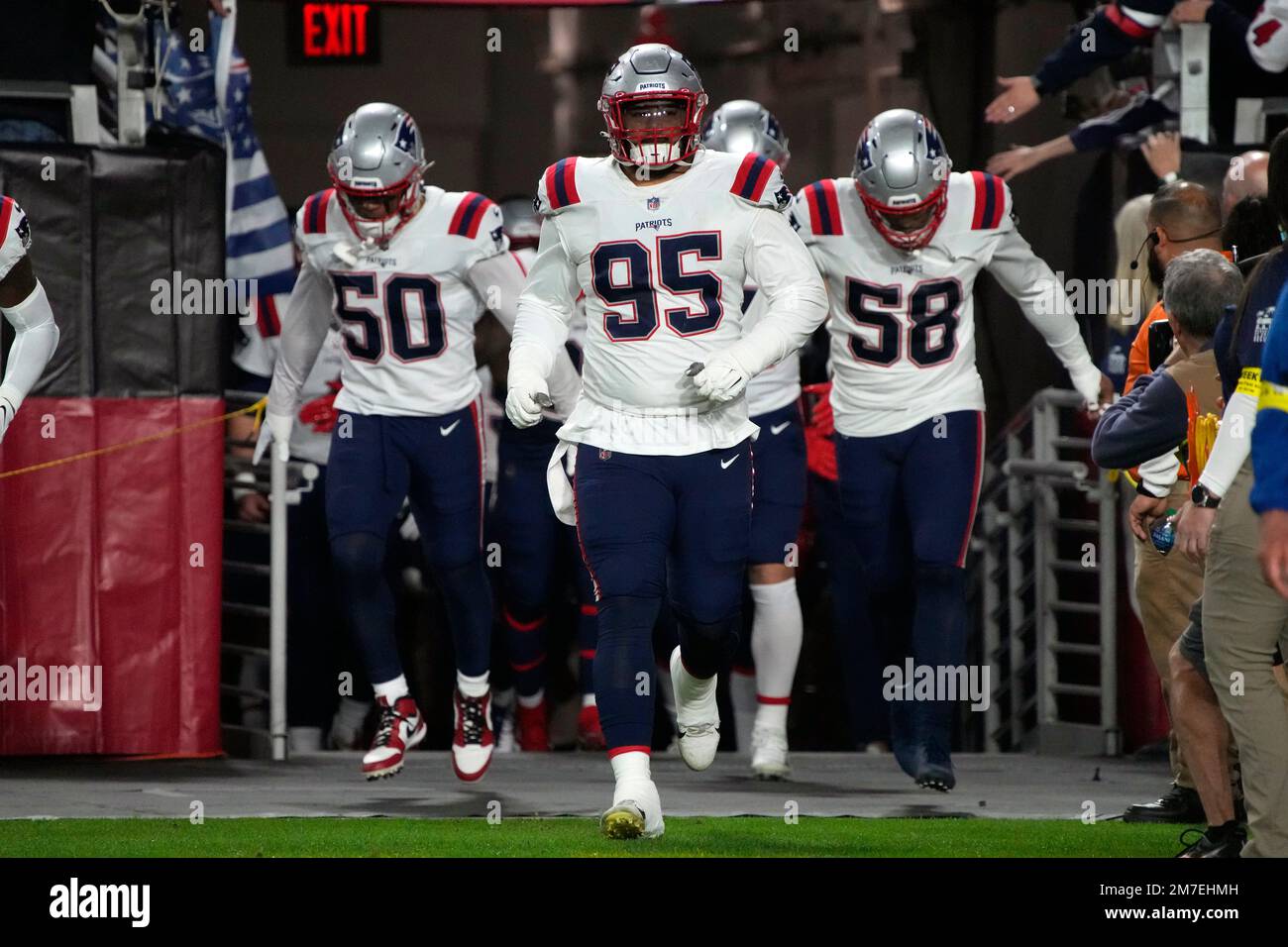 New England Patriots defensive tackle Daniel Ekuale (95) leads the team ...