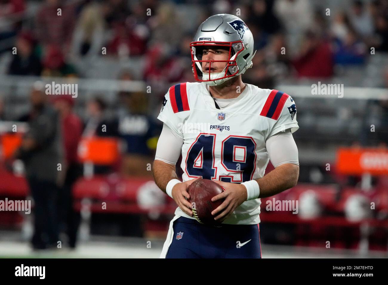 New England Patriots long snapper Joe Cardona (49) warms up before an ...