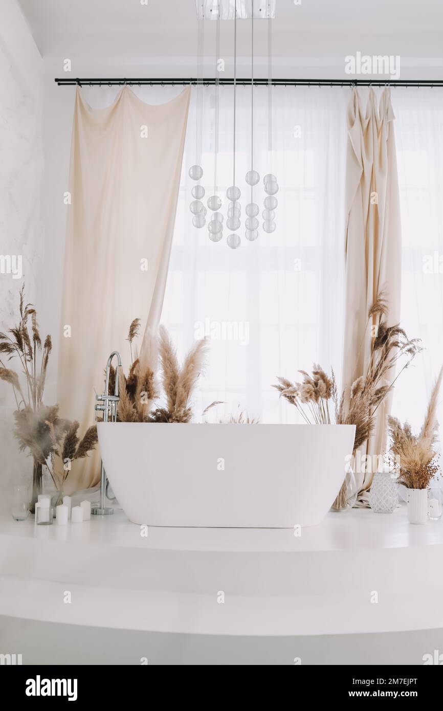 Modern white bathroom. White bath in a room with white walls. Interior ...
