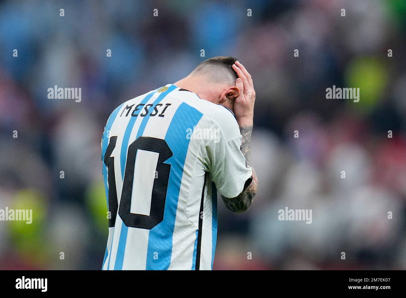 Argentina's Lionel Messi covers his face after beating Croatia 3-0 in a ...