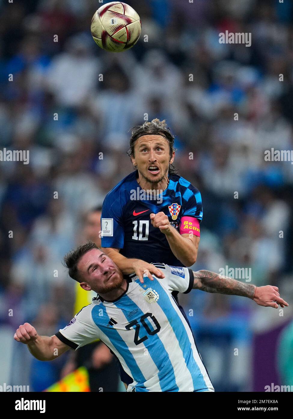 Croatia's Luka Modric heads the ball over Argentina's Alexis Mac ...