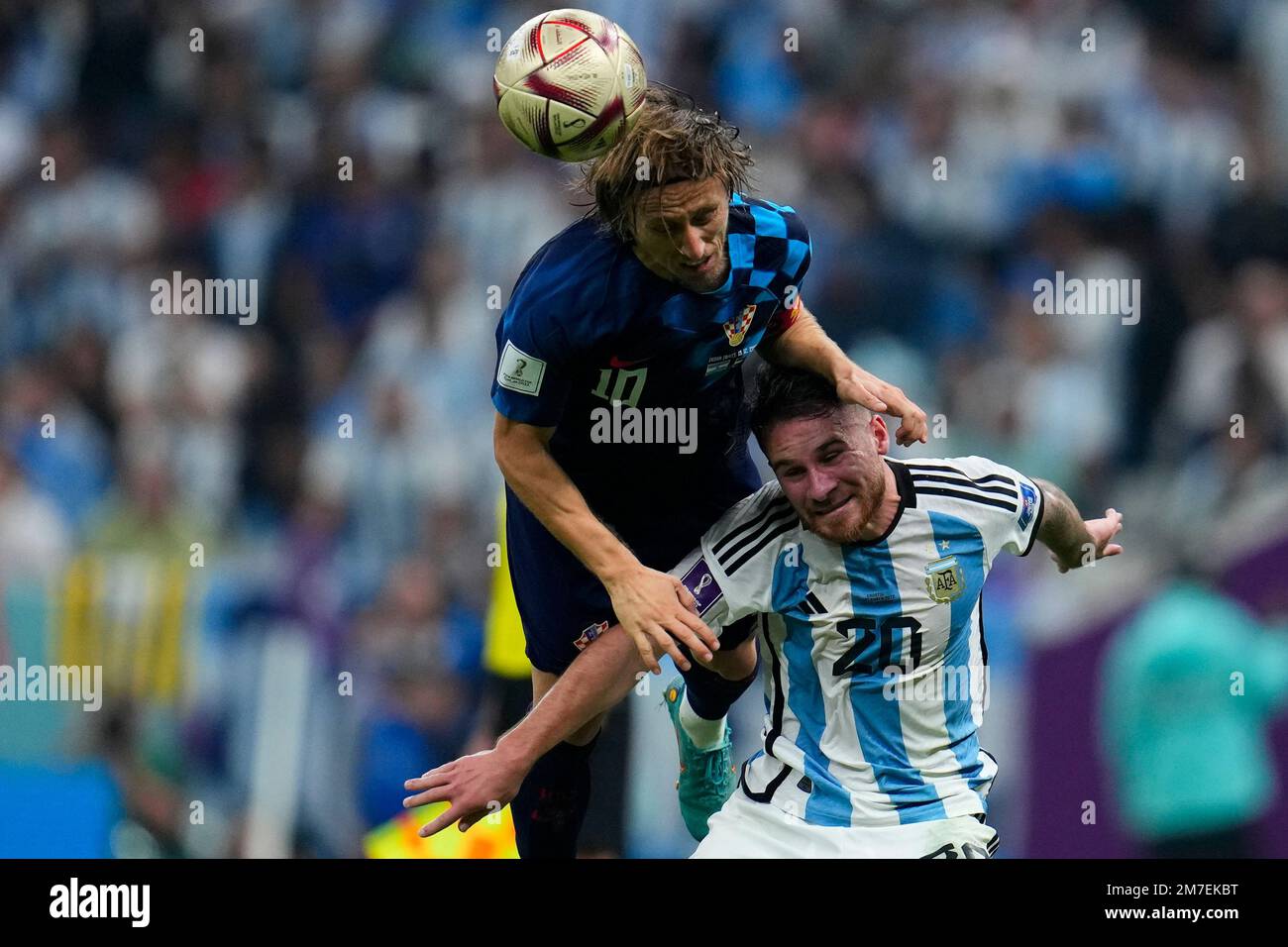 Croatia's Luka Modric heads the ball over Argentina's Alexis Mac ...