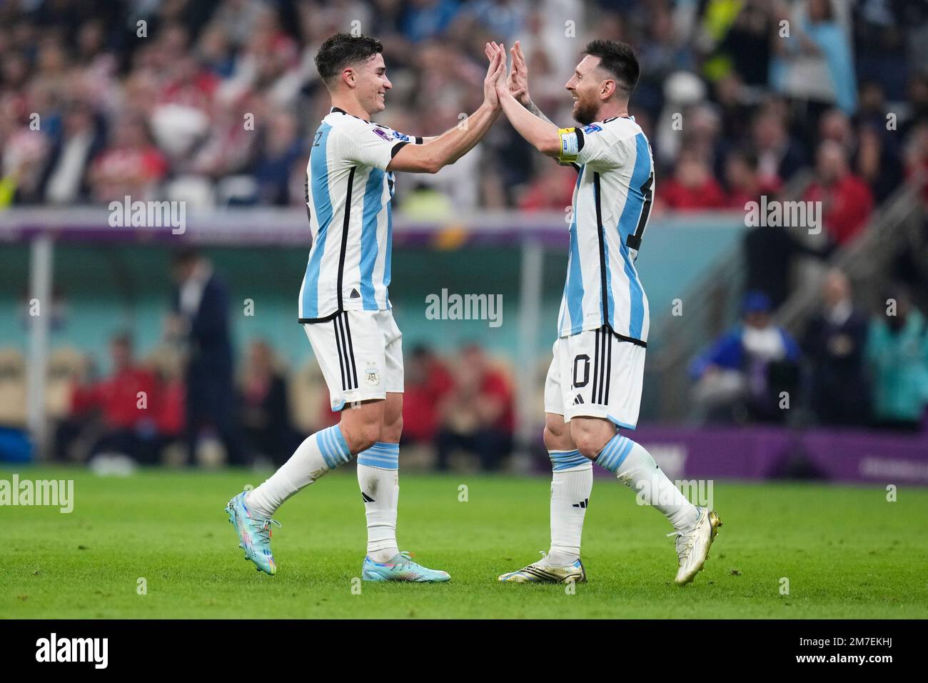 Argentina's Julian Alvarez, left, and Lionel Messi celebrate after ...