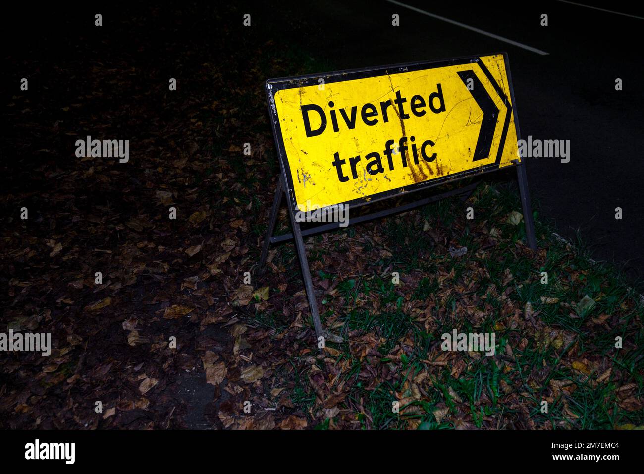 Road signs illuminated in the night by camera flash and reflecting ...