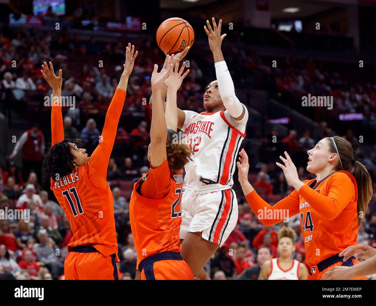 Ohio State forward Cotie McMahon (32) shoots between Illinois guard ...