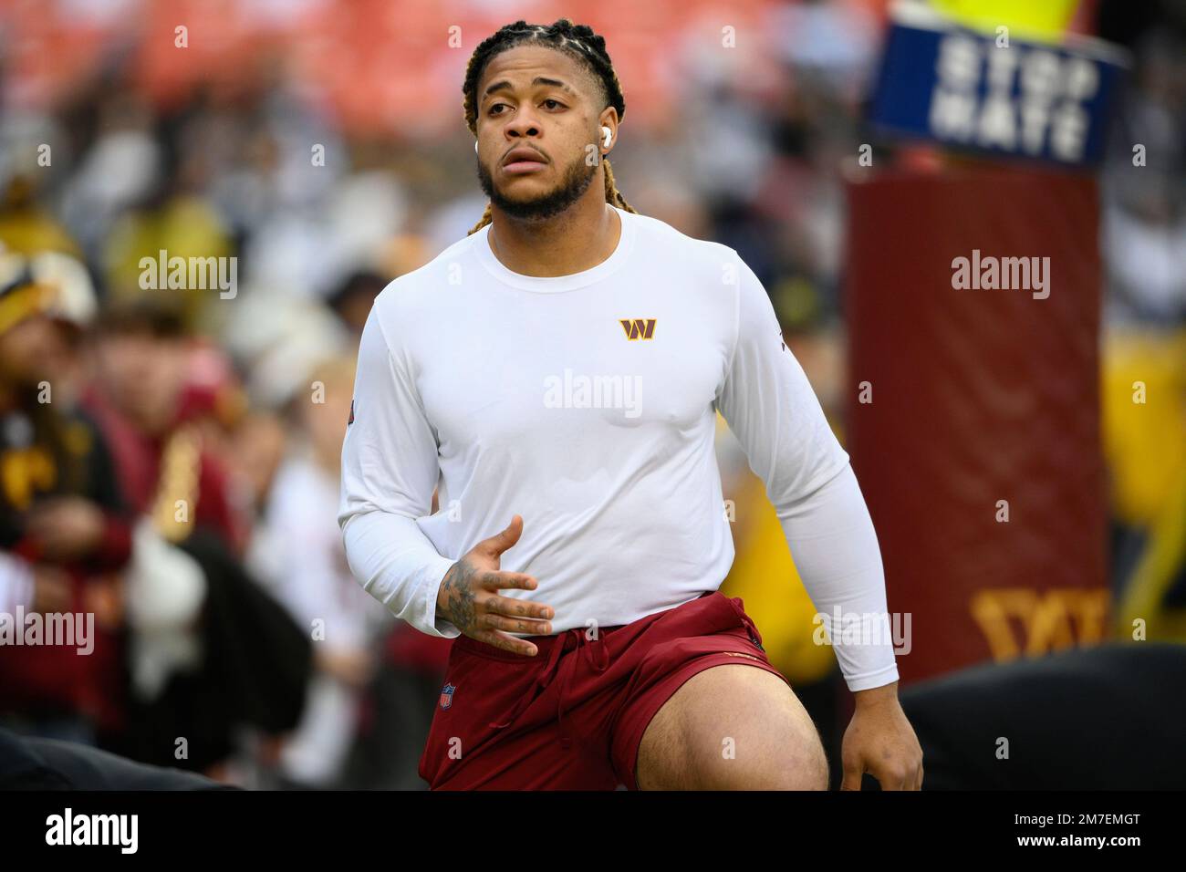 Washington Commanders defensive end Chase Young (99) stretching on the ...