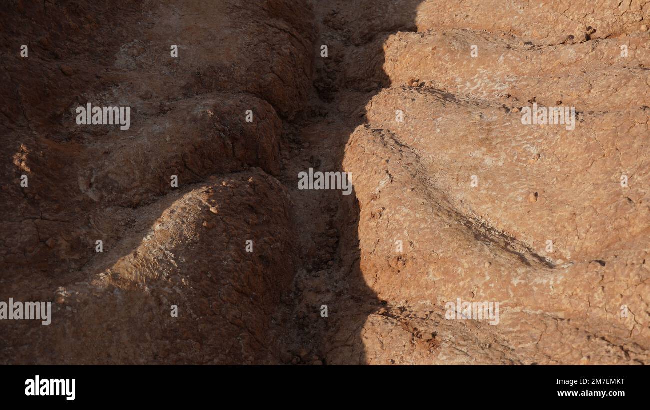 View of soil erosion. Rain water streams made bizarre shapes of clay ...