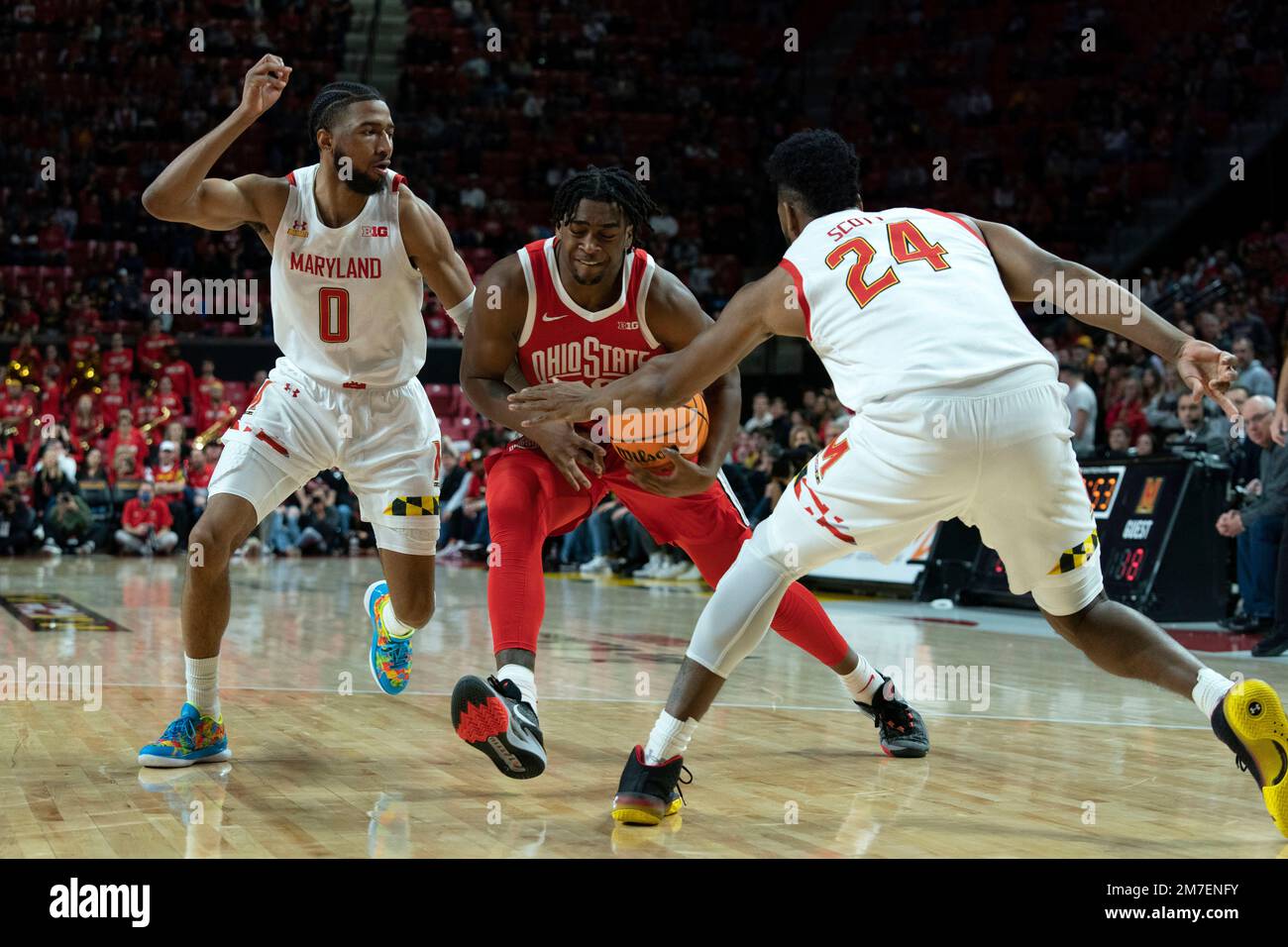 Ohio State's Brice Sensabaugh, center, drives the ball between Maryland ...