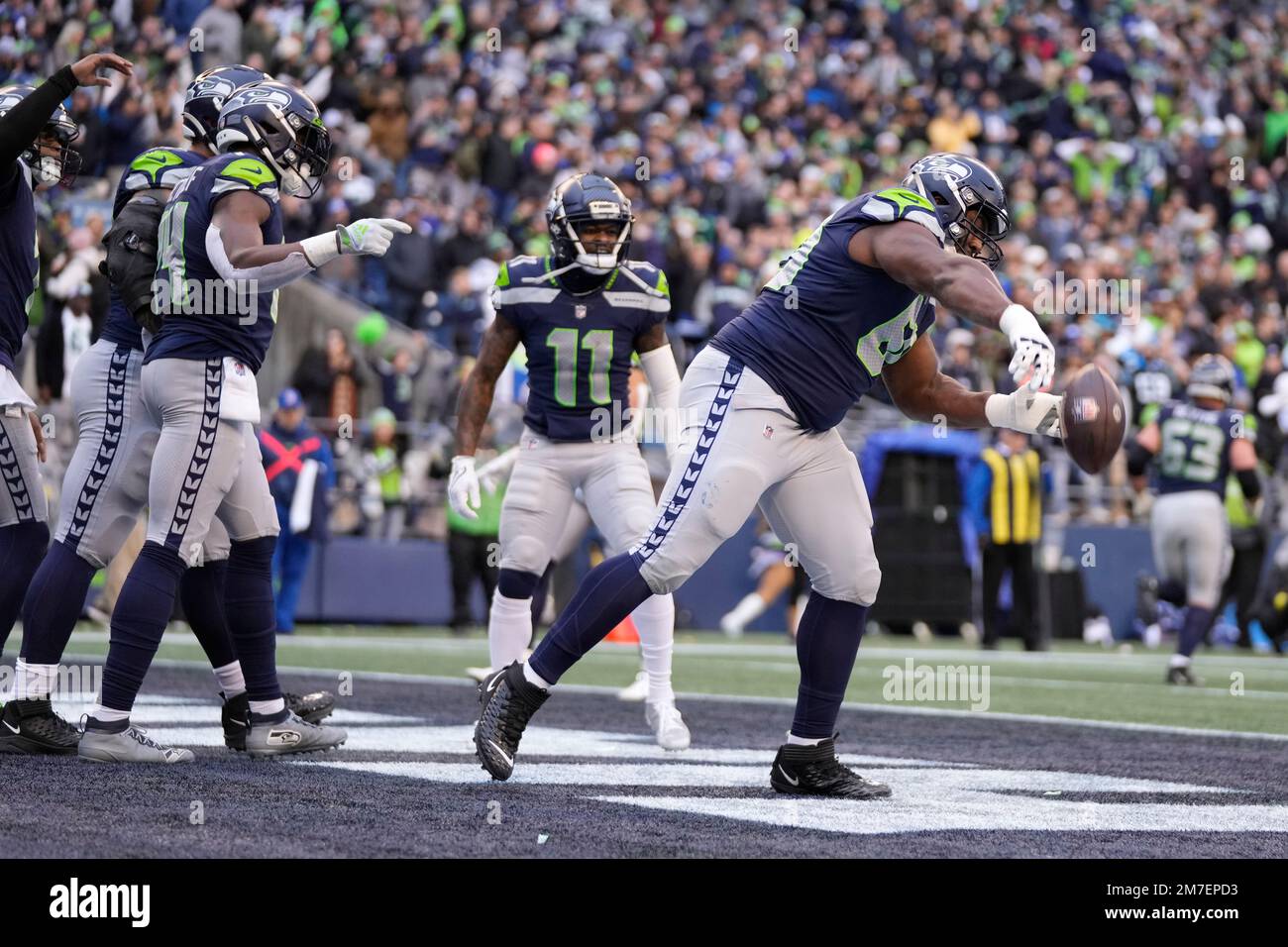 Seattle Seahawks guard Phil Haynes (60) spikes the ball during an NFL ...