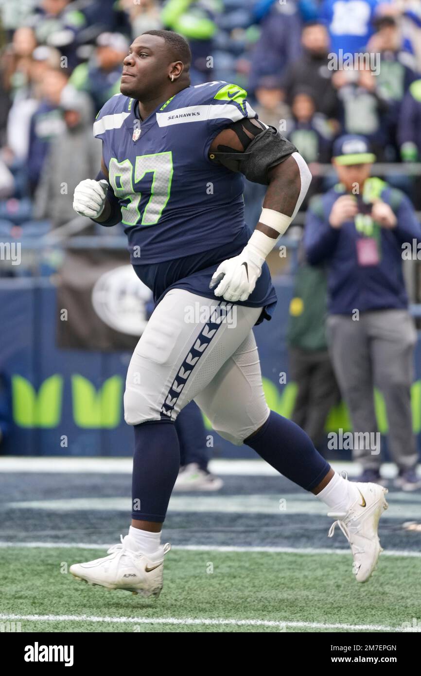 Seattle Seahawks defensive tackle Poona Ford (97) runs onto field ...