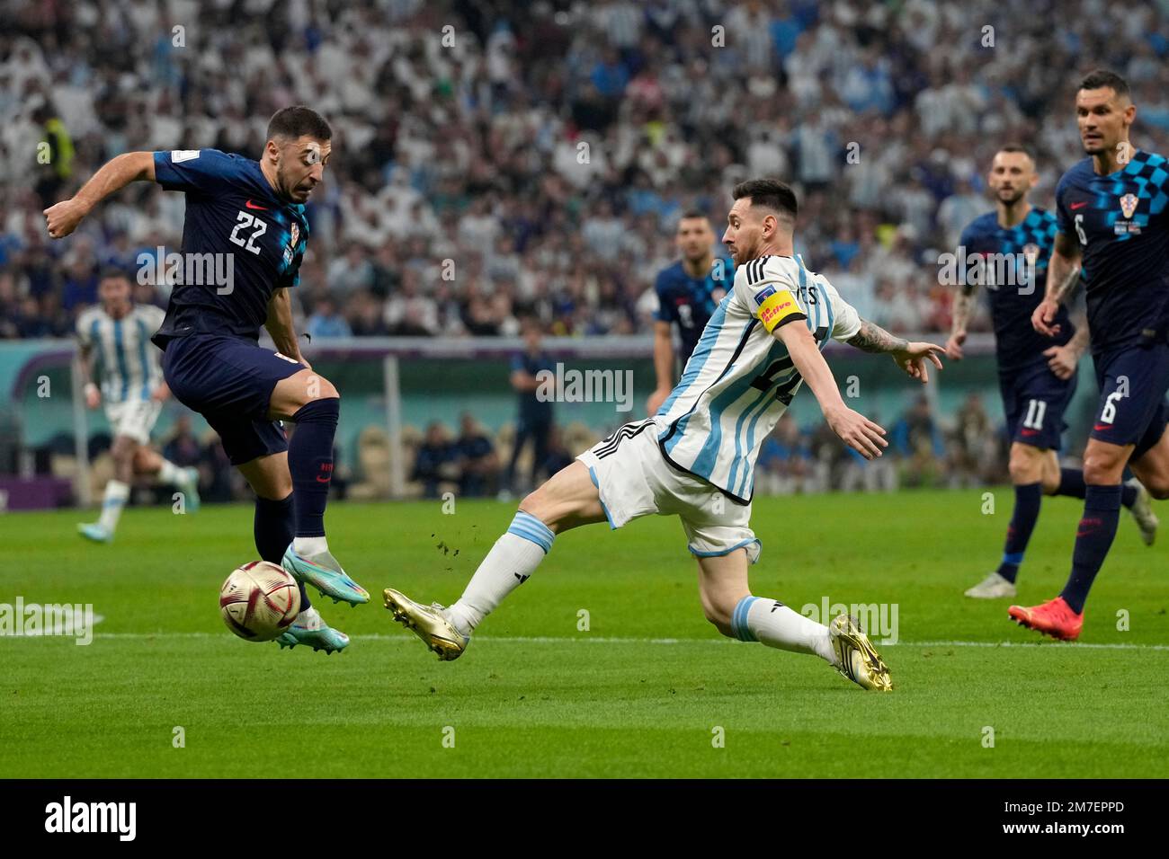 Argentina's Lionel Messi vies for the ball with Croatia's Josip ...