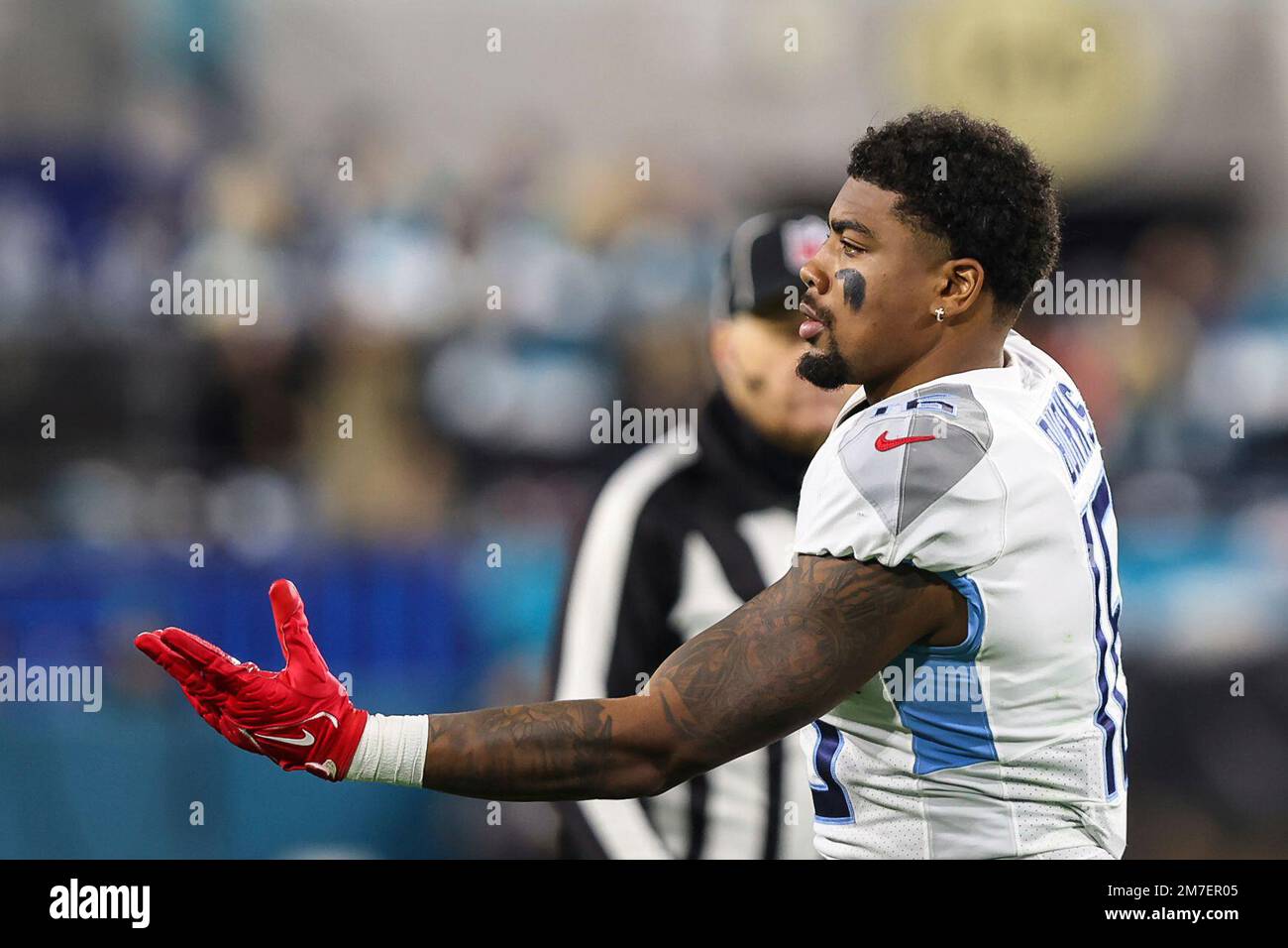 Tennessee Titans wide receiver Treylon Burks (16) tosses a ball to a ...