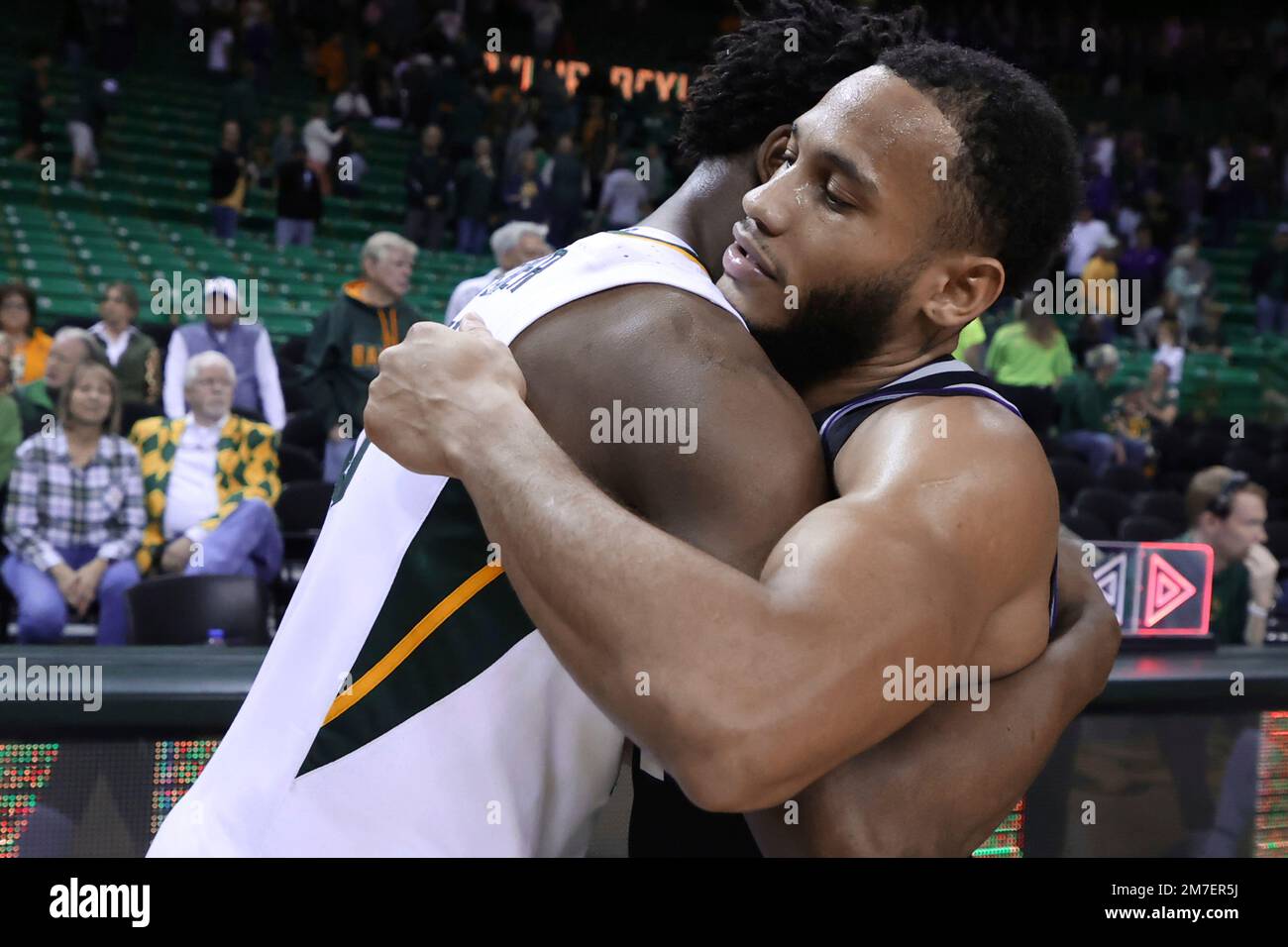 Kansas State guard Markquis Nowell, right, hugs Baylor guard Adam ...
