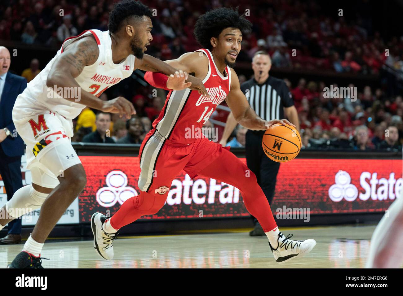 Ohio State's Justice Sueing, right, drives the ball as Maryland's Donta ...