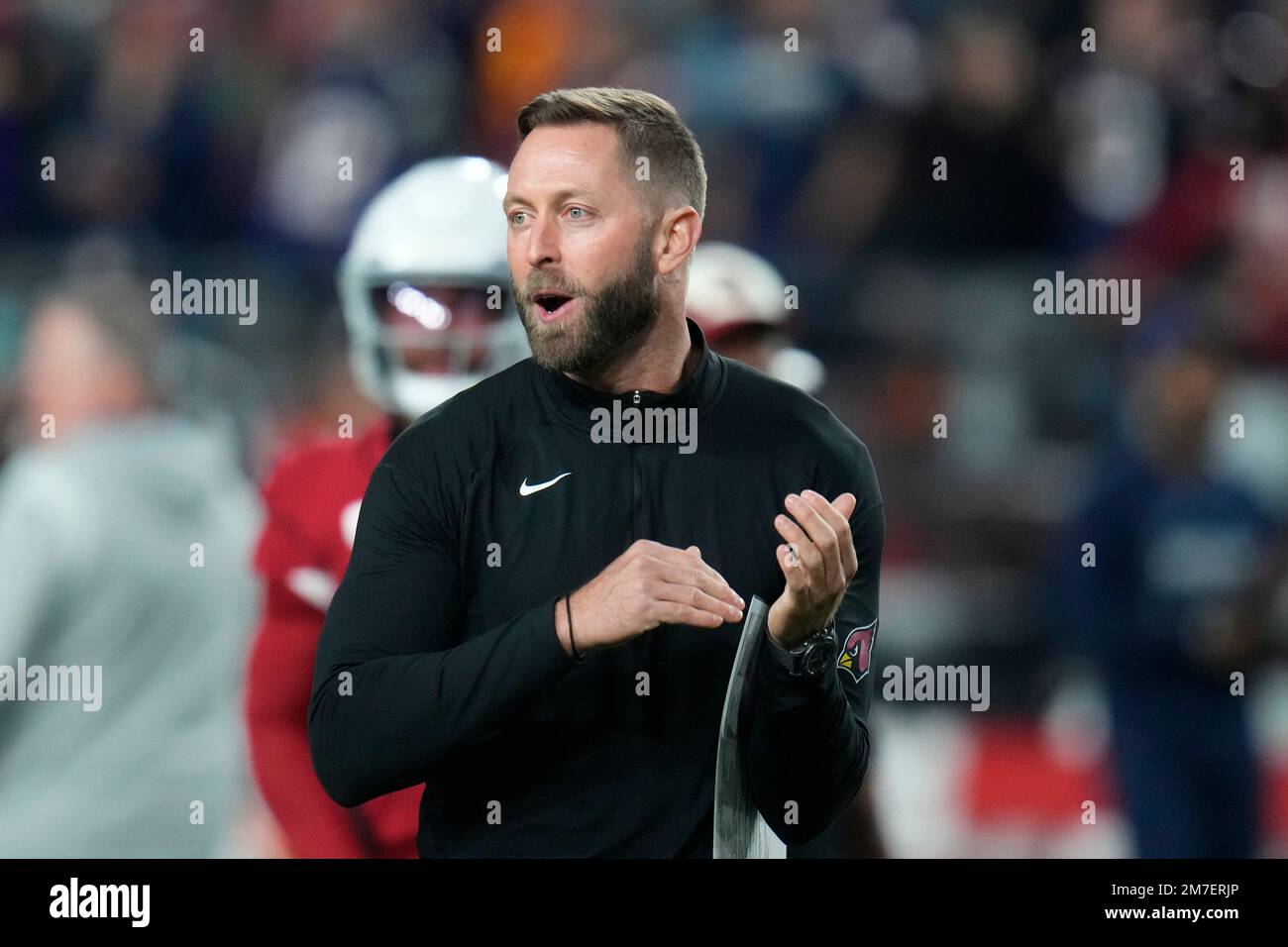 Arizona Cardinals head coach Kliff Kingsbury applauds his players as ...
